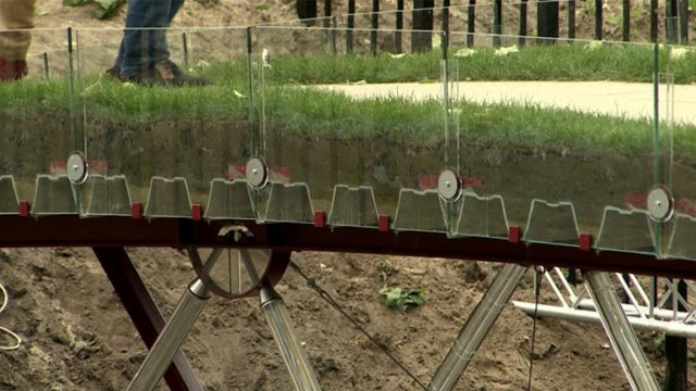 World’s first bridge with glass columns strong enough to hold student ...