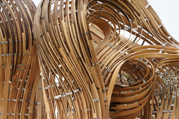 A steam-bent hardwood pavilion made with AR - MaterialDistrict