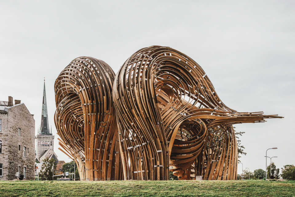 A steam-bent hardwood pavilion made with AR - MaterialDistrict