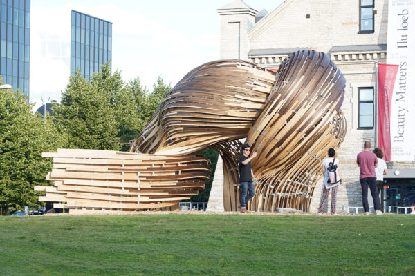 A steam-bent hardwood pavilion made with AR - MaterialDistrict