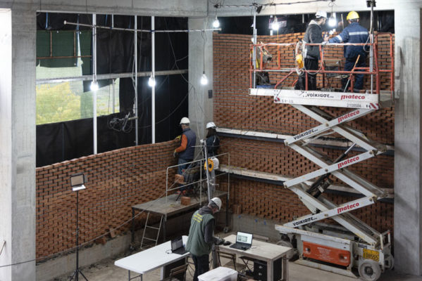 A semi-transparent brick façade made with augmented bricklaying ...