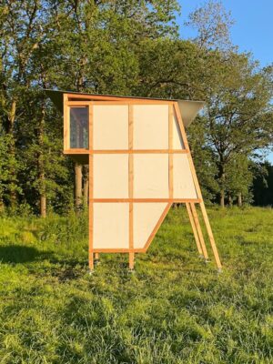 A temporary overnight location made of canvas and wood - MaterialDistrict