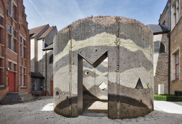 A pavilion made of metal grid and various material layers ...